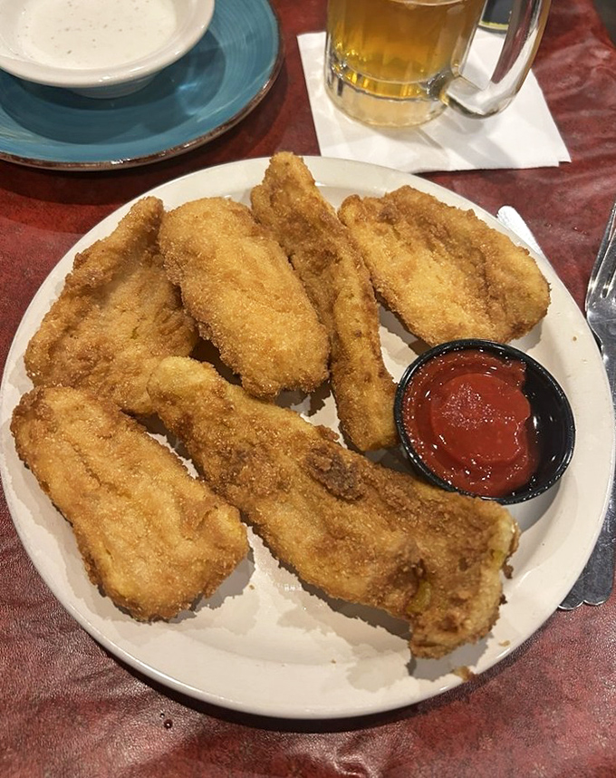 Fried chicken tenders with the golden ratio of crunch-to-tenderness. That dipping sauce isn't optional&mdash;it's essential to the experience.