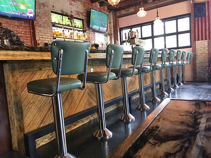 Bar stools that invite lingering, TVs for game day, and enough bottles to ensure your spirit of choice is well represented.