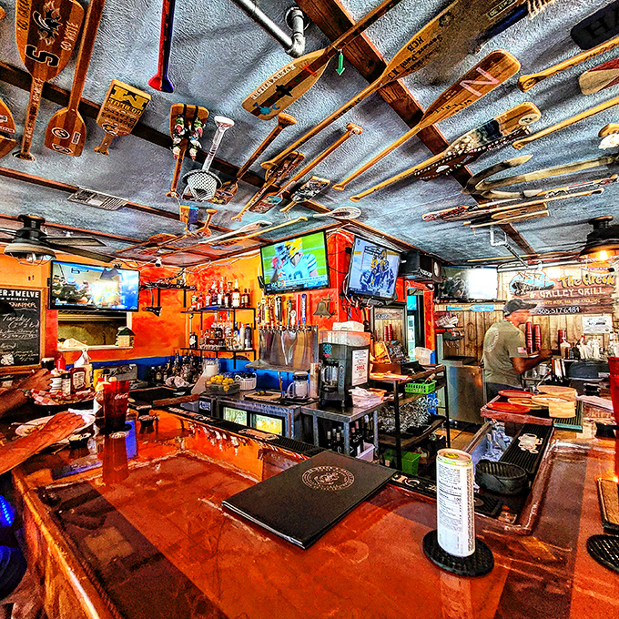 The ceiling decorated with fishing gear isn't trendy design&mdash;it's authentic Keys character. This bar has stories to tell if you're willing to listen.