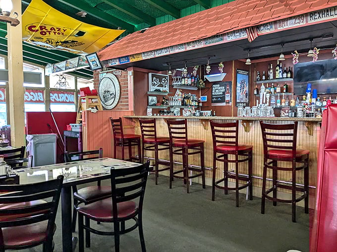 The bar area: where breakfast enthusiasts graduate to lunch connoisseurs. Green ceilings and brick walls create the perfect backdrop for food-induced happiness.