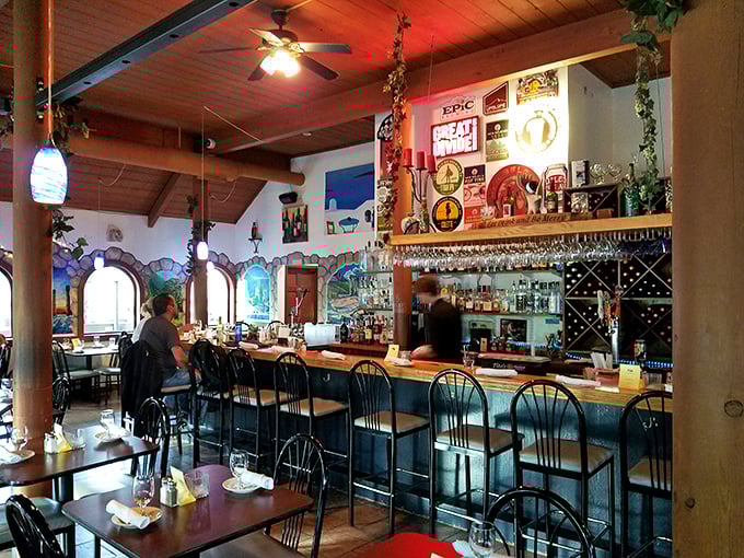 The bar area feels like the heart of a Greek home &ndash; warm wood tones, hanging glassware, and the promise of ouzo-fueled conversations.