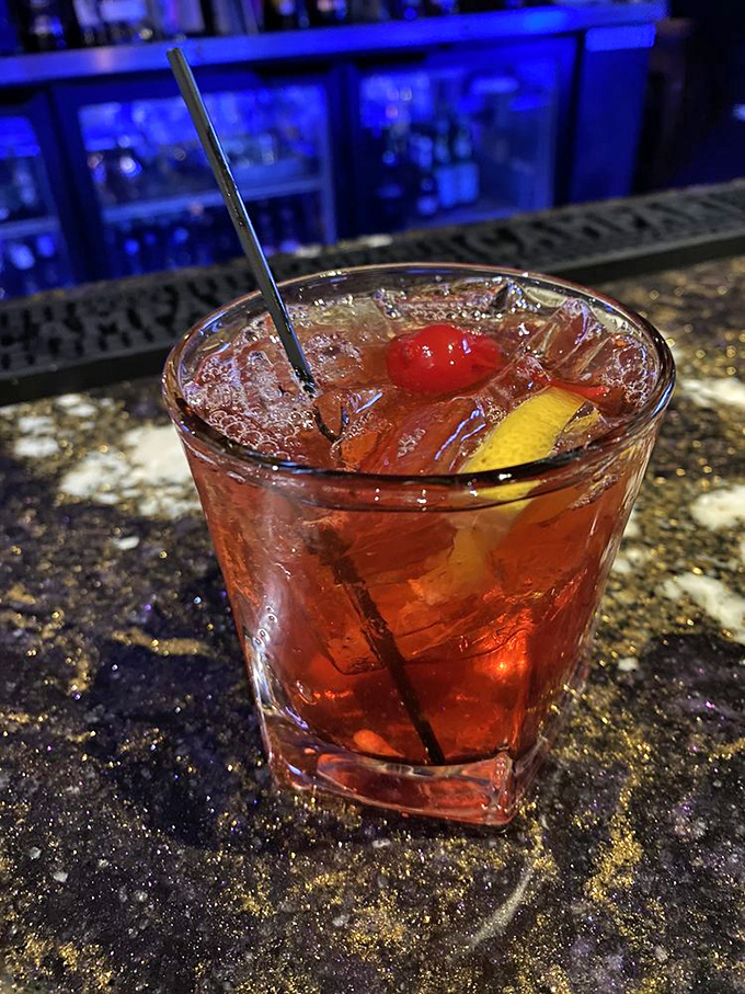 An Old Fashioned that Don Draper would approve of&mdash;amber liquid, proper garnish, and enough potency to make dinner conversation flow like poetry.
