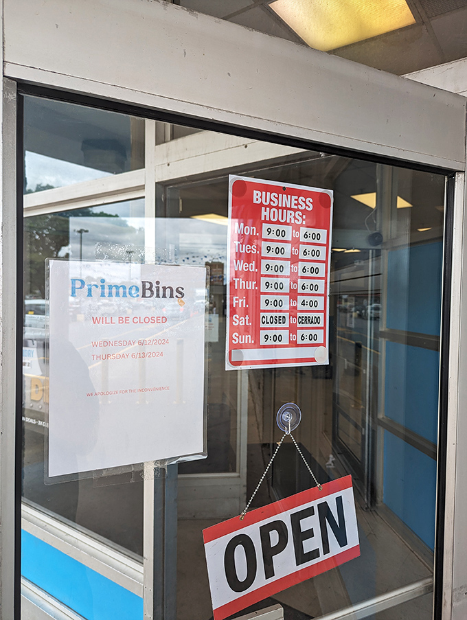 The door signs tell the tactical shopper everything they need to know—when to arrive, when to pounce, and when to plan their next treasure hunt.