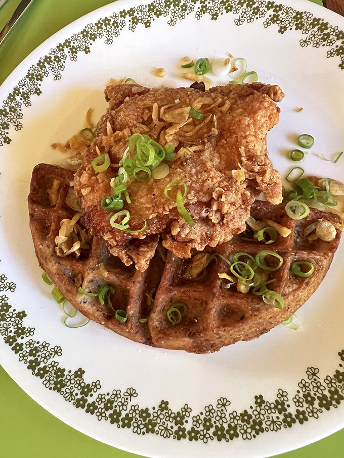 Chicken and waffle reimagined with green onions adding pops of color and flavor. The kind of breakfast-dinner mashup that makes you question meal boundaries.