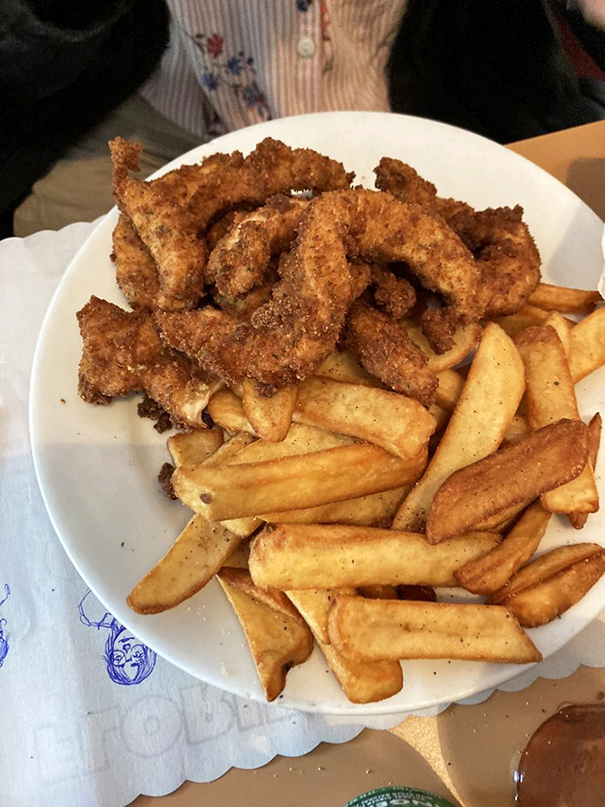 Crispy chicken tenders that make you forget you're technically an adult. The kind of fries worth fighting your kids for.