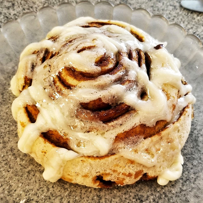 This cinnamon roll isn't just breakfast &ndash; it's an event. That cream cheese frosting melting into warm, spiraled dough is practically hypnotic.