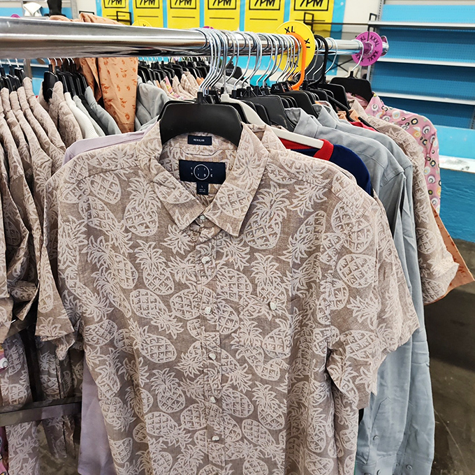 A tropical-patterned shirt from a recognizable brand hangs ready for its next adventure, whether that's a backyard barbecue or an actual tropical getaway.