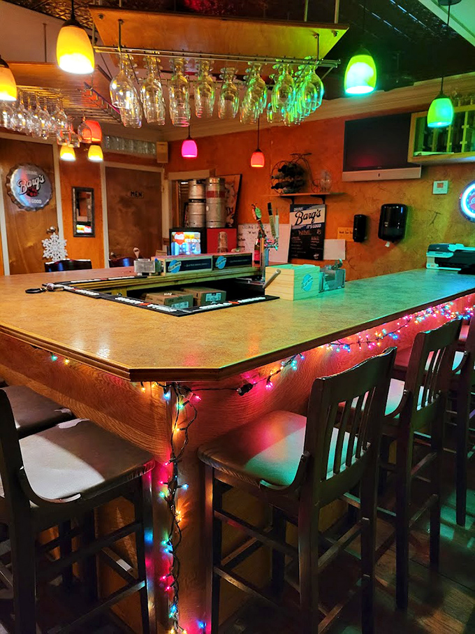 The bar area glows with festive lights, promising good times and better drinks. Where locals gather and visitors become regulars. 