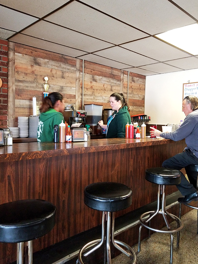 The counter seating where locals gather to discuss life's important matters over plates of exceptional barbecue and sweet tea.