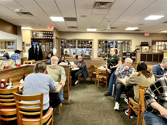 The dining room hums with the satisfied murmurs of patrons who've found their happy place between two slices of rye bread.