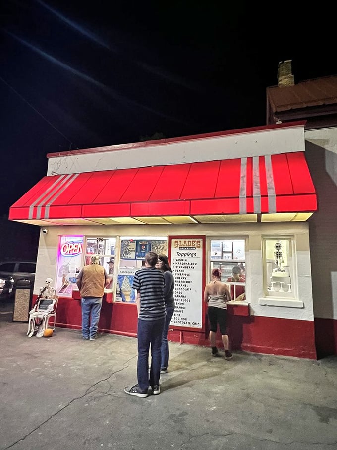As night falls, the glow of Glade's becomes a beacon for ice cream seekers, with Halloween decorations adding seasonal charm.