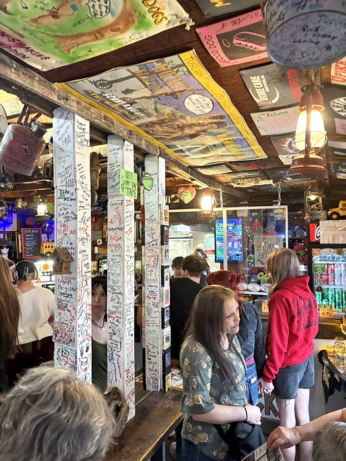 The interior where every surface tells a story. Thousands of signatures create a guest book that's also the building itself.