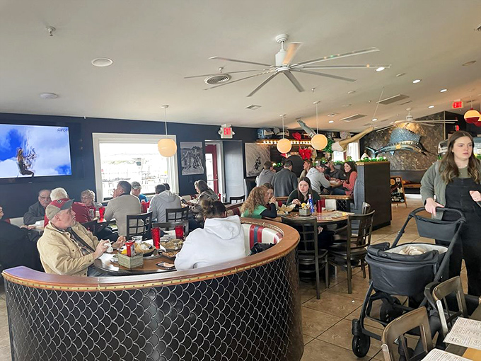 Inside, the dining room buzzes with the happy chaos of people making memories over meals – the universal language of good food bringing everyone together.