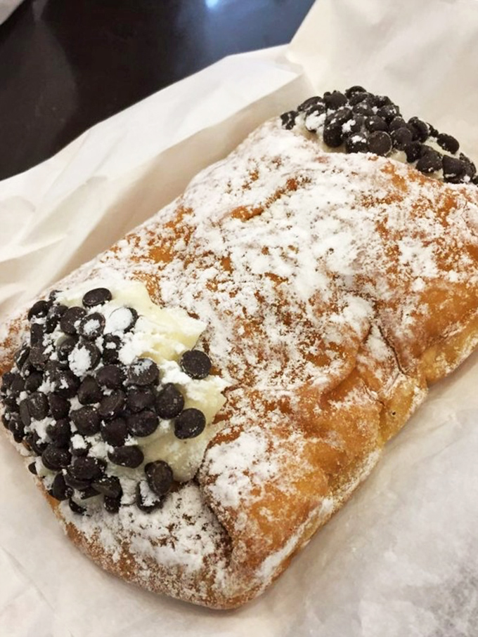 A rectangular pastry masterpiece dusted with powdered sugar and studded with chocolate chips&mdash;like a dessert that couldn't decide what it wanted to be when it grew up.