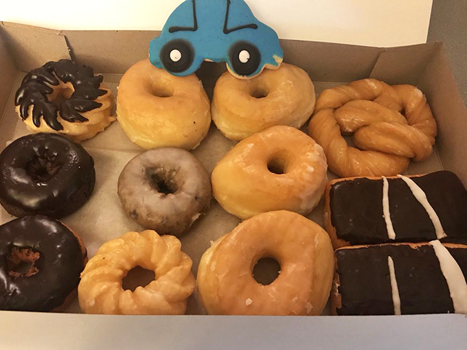 A dozen reasons to share (or not). Nord's variety box showcases their range, from classic glazed to whimsical car-topped creations that make breakfast an adventure.