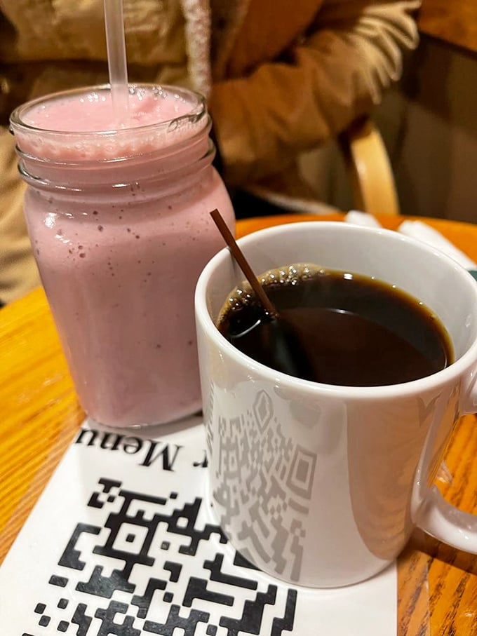 The strawberry smoothie and coffee duo&mdash;because sometimes breakfast requires both immediate caffeine and the promise of fruit-based virtue.