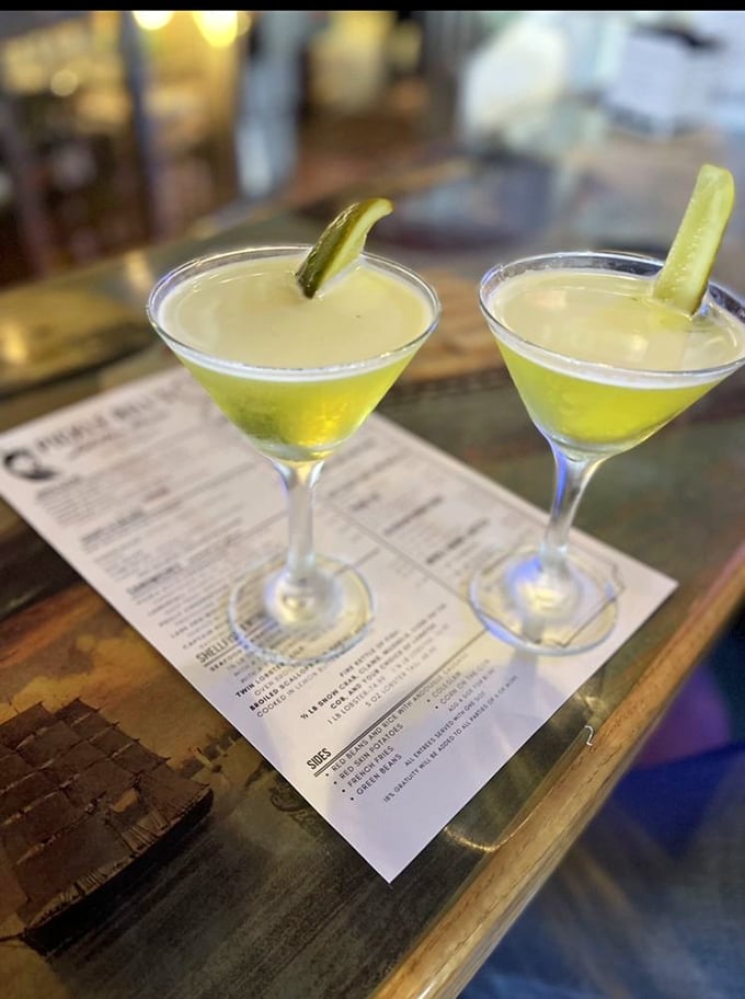 Pickle-garnished martinis that say "Yes, we're serious about seafood, but we know how to have fun with our cocktails too."