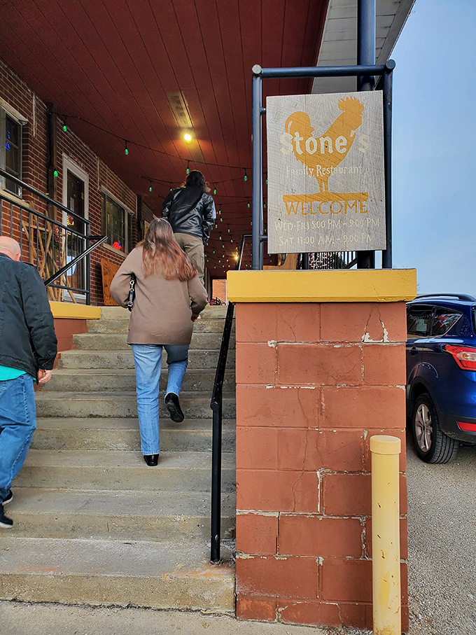 The welcoming rooster sign greets visitors climbing the steps to Stone's, promising good food and zero pretension inside.