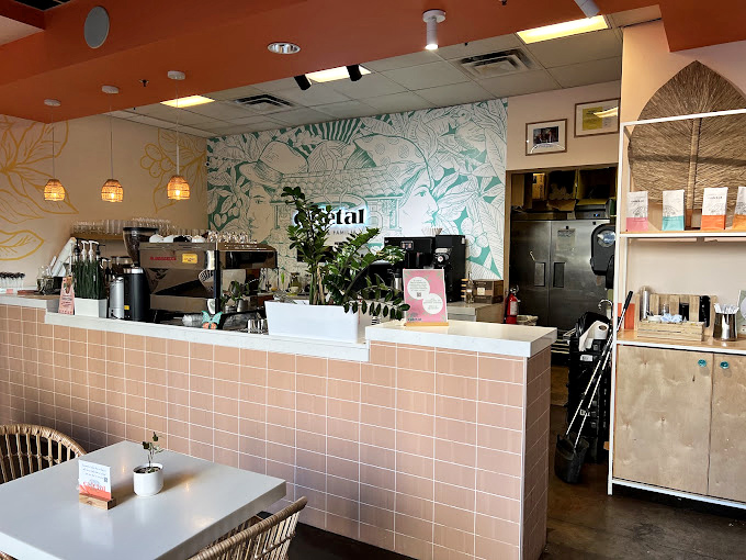 Behind this counter, coffee magic happens daily. The pink-tiled barista station is where Colombian traditions meet Arizona energy in perfect caffeinated harmony.