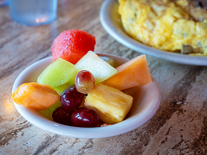 A fresh fruit cup that provides the illusion of healthiness before diving into that three-egg omelet. Balance is everything.