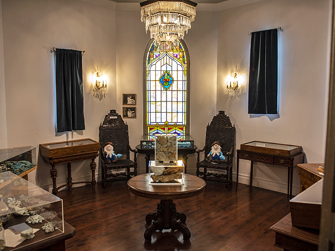 Fit for royalty, this elegant alcove features carved wooden chairs, stained glass windows, and carefully curated display cases showcasing some of the museum's finest specimens.
