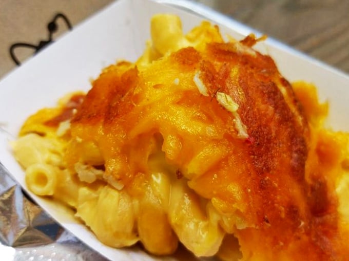 Mac and cheese with that perfectly browned top, like a cheese volcano stopped in its glorious moment of bubbling eruption.