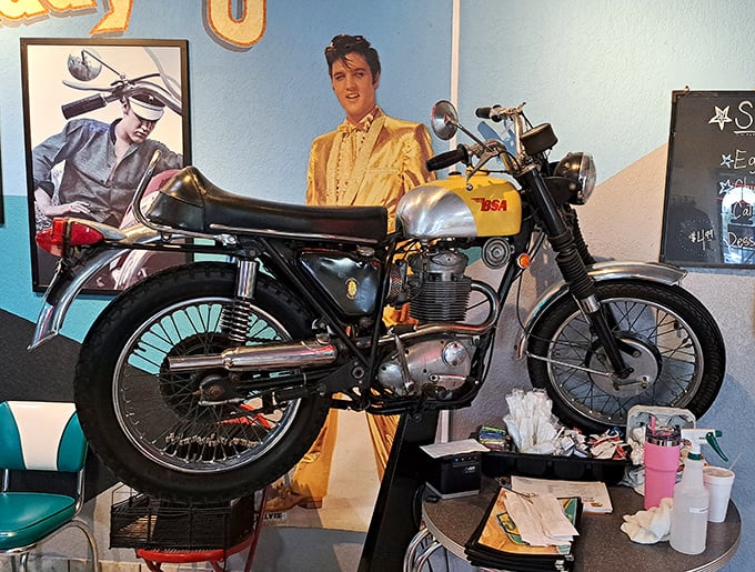 Nothing says "we take our nostalgia seriously" like a vintage motorcycle parked next to a life-sized Elvis&mdash;a conversation starter that never runs out of gas.