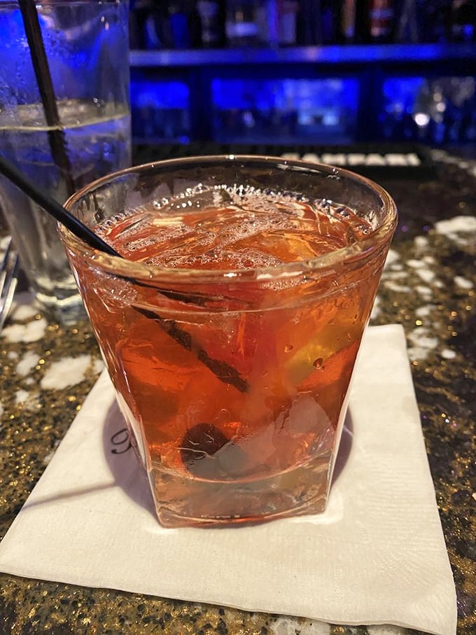 An Old Fashioned that looks like liquid amber in crystal—the kind of drink that makes you want to discuss jazz or complain about how movies aren't made like they used to be.