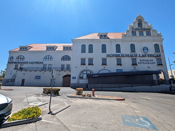 The stark white exterior stands like a Bavarian castle that took a wrong turn at Albuquerque and decided Vegas was close enough.