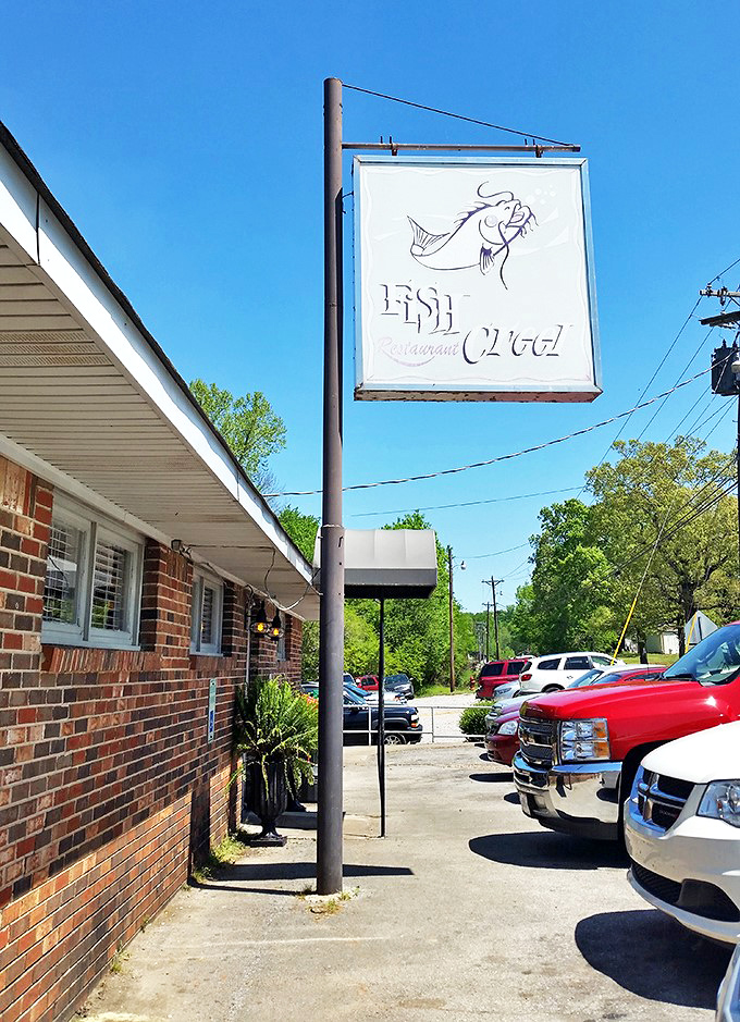That classic Fish Creel sign against the blue Alabama sky&mdash;a beacon of hope for hungry travelers and a landmark for locals in the know.