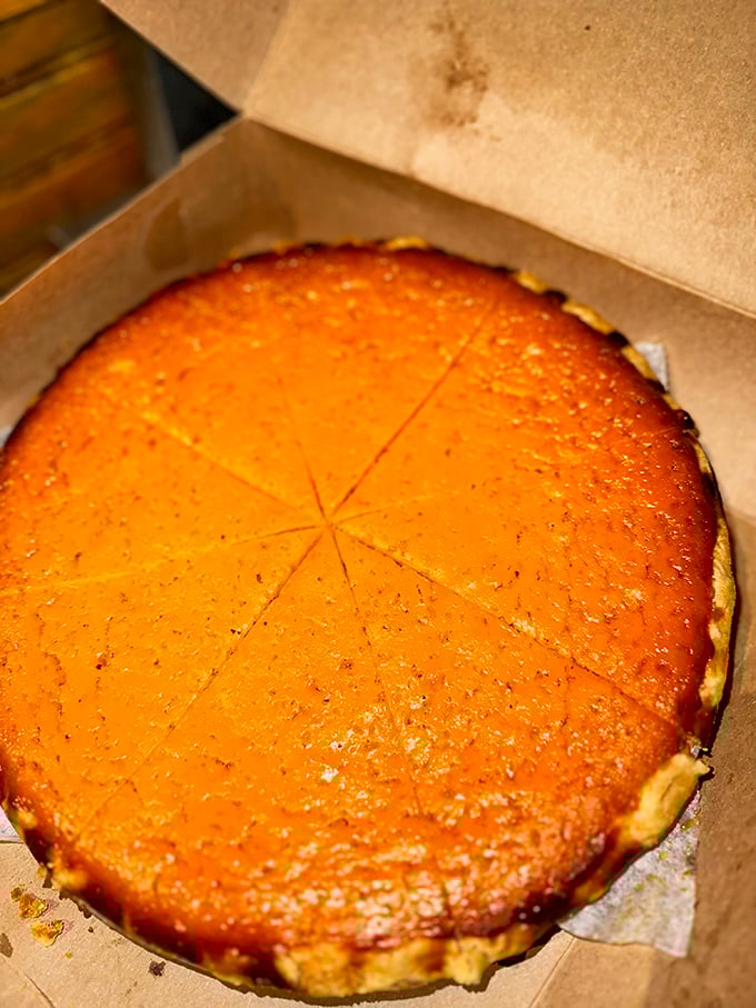 Sweet potato pie with that perfect caramelized top. The kind of dessert that makes you consider skipping the main course next time.