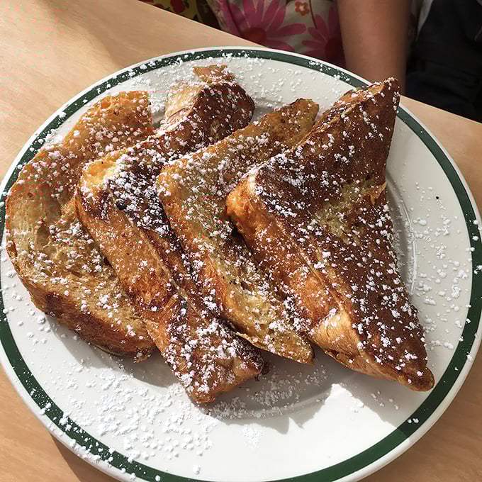 Three triangles of French toast perfection that prove sometimes the simplest presentation lets quality ingredients shine brightest.