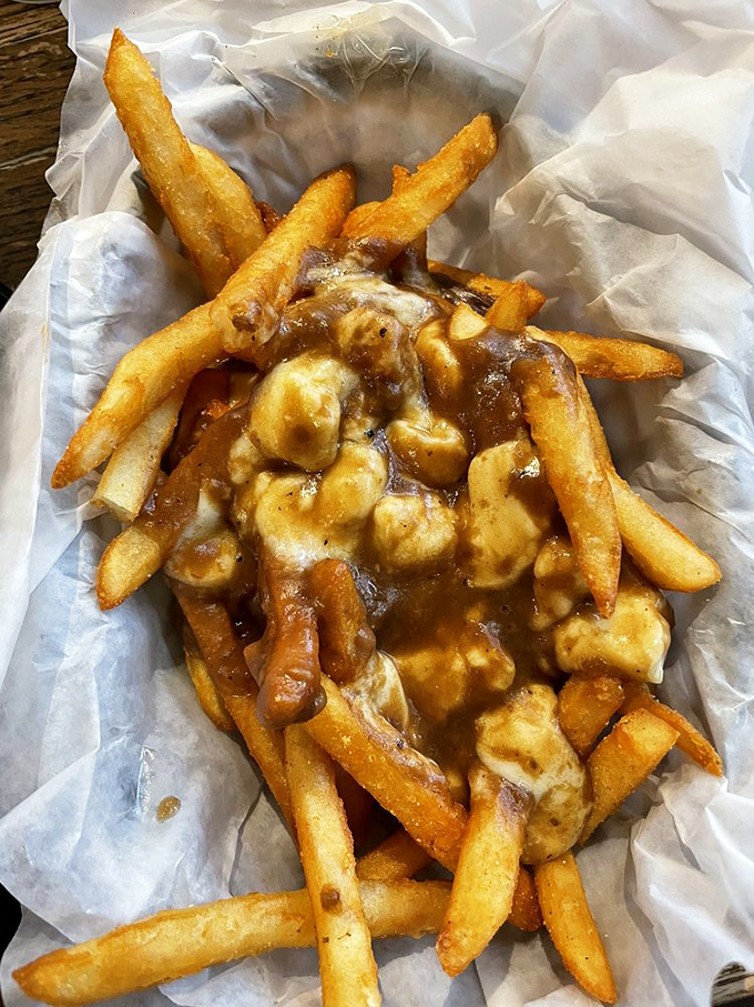 Poutine fries smothered in gravy and cheese curds&mdash;the Canadian classic gets a Midwest makeover that would make even the walking dead drool.
