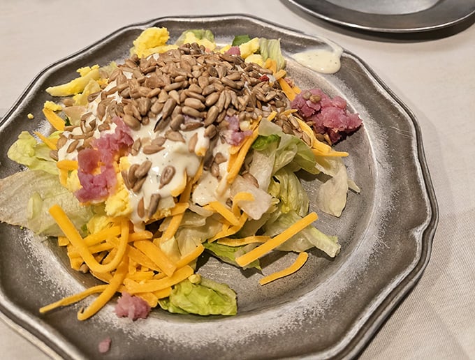 The salad isn't just a prelude &ndash; with those sunflower seeds and shredded cheese, it's a supporting actor worthy of its own recognition.