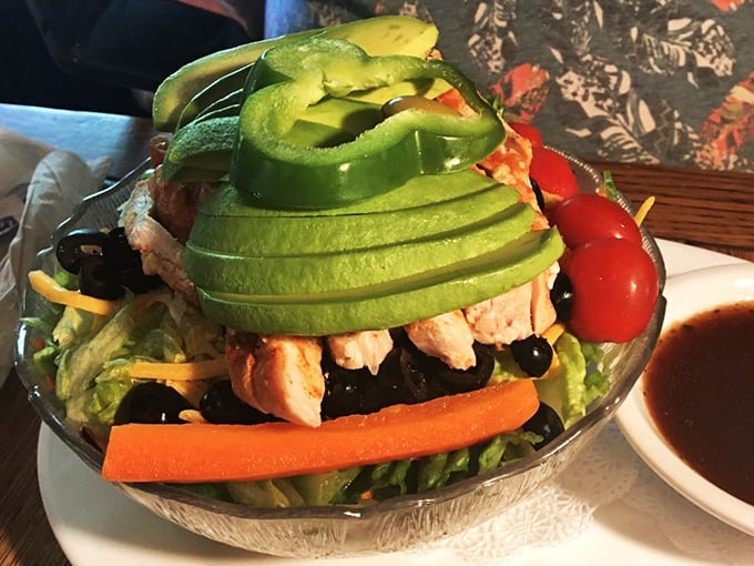 The outdoor seating area offers a peaceful retreat where picnic tables and fresh mountain air enhance every bite. 