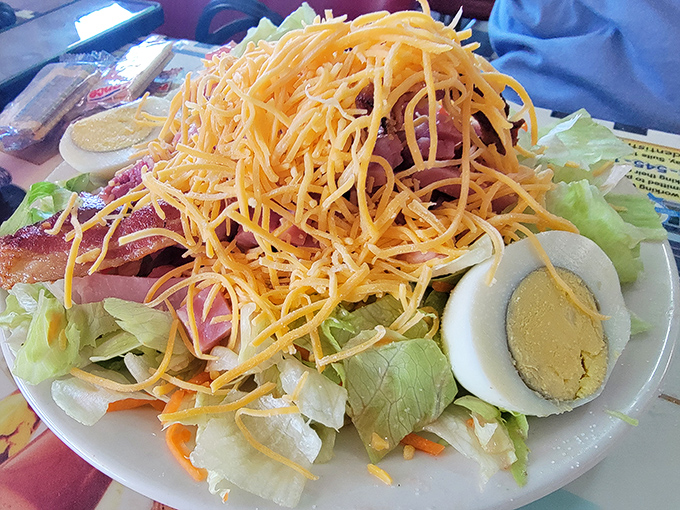 A chef's salad that doesn't apologize for its simplicity. That mountain of cheese says, "Yes, this is still diner food."