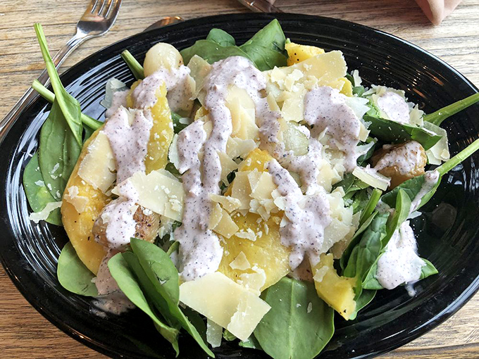 A salad that's clearly just visiting from the "technically healthy" section of the menu, dressed up with enough cheese to make a Bavarian proud.