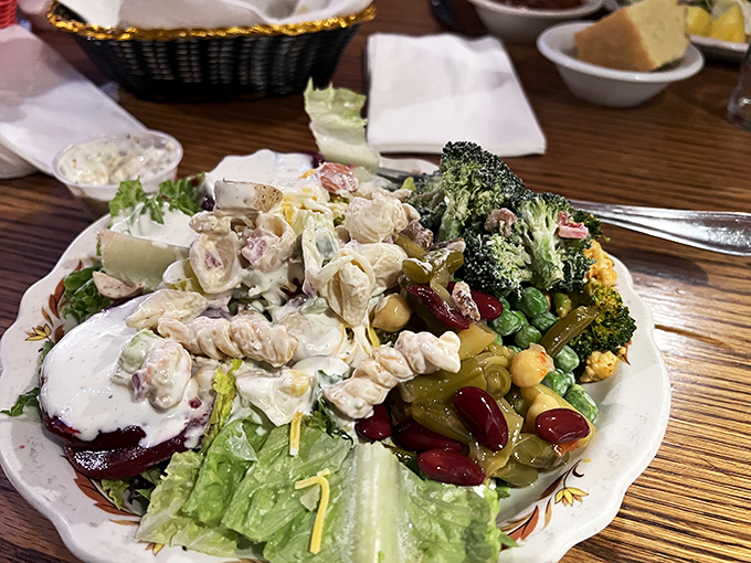The salad bar offerings prove vegetables deserve respect too. This plate isn't just colorful&mdash;it's the perfect guilt-reducer before tackling that 16-ounce ribeye. 