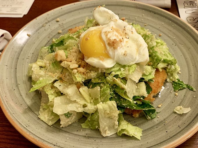Even the salad gets special treatment&mdash;fresh crisp greens crowned with a perfectly poached egg that's just waiting to create its own dressing.