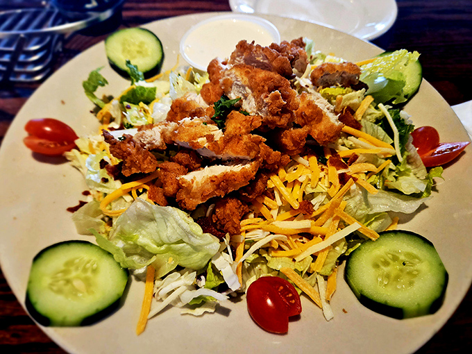 A salad that doesn't apologize for being a salad. Those cucumber slices standing guard at the perimeter are taking their job very seriously.