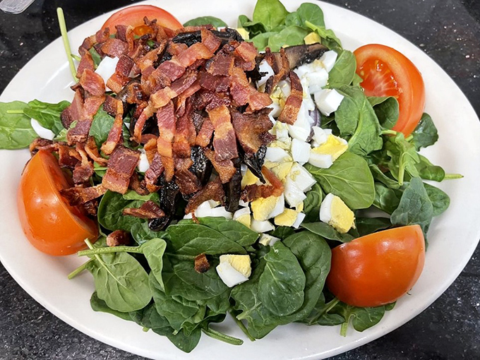 This isn't just a salad&mdash;it's a negotiation between virtue and vice, where spinach makes peace with bacon and hard-boiled eggs play neutral diplomats.