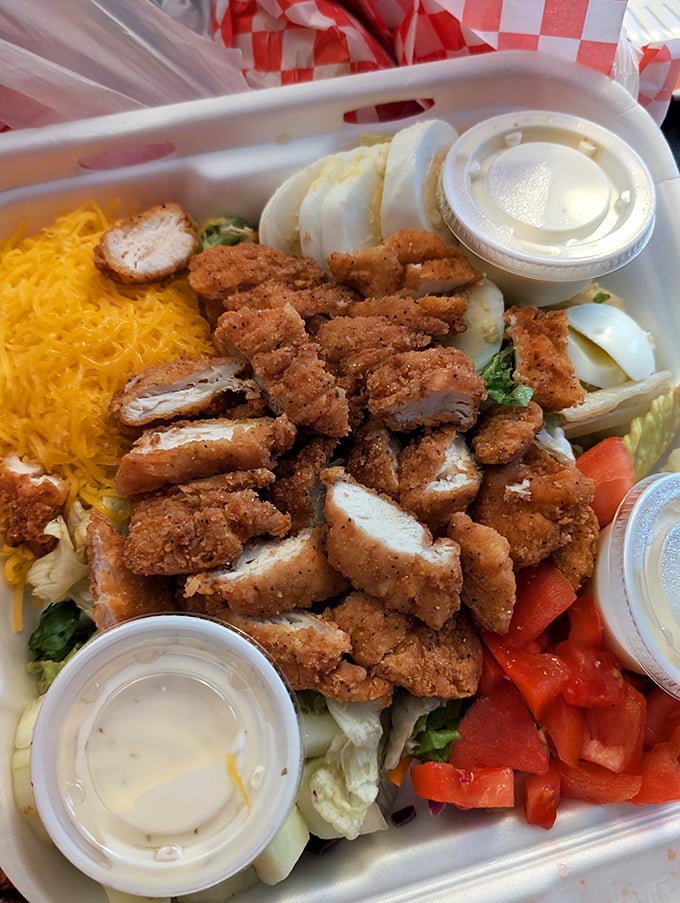 Salad: Even Ray's to-go options maintain the integrity of fresh ingredients and generous portions that define the diner experience.