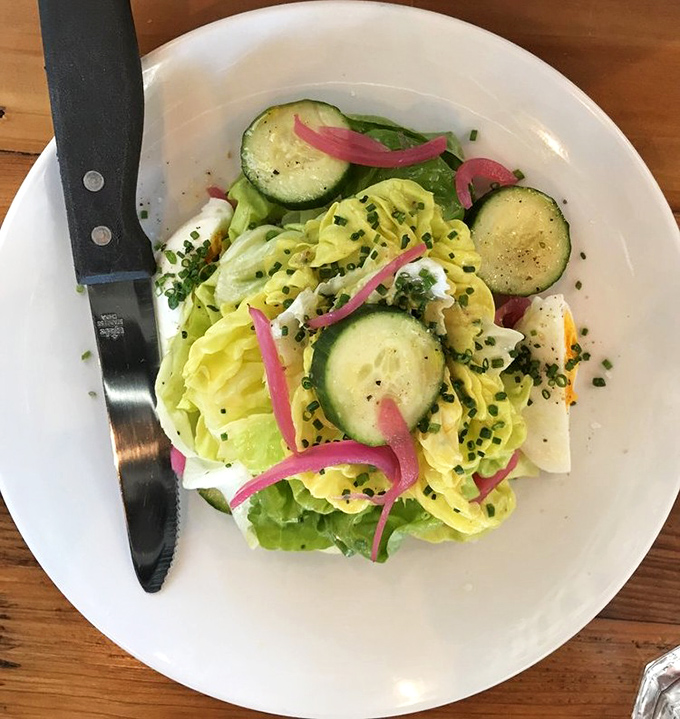 A salad that doesn't apologize for being healthy—bright, crisp, and zingy with pickled onions. Proof that not everything delicious requires butter.