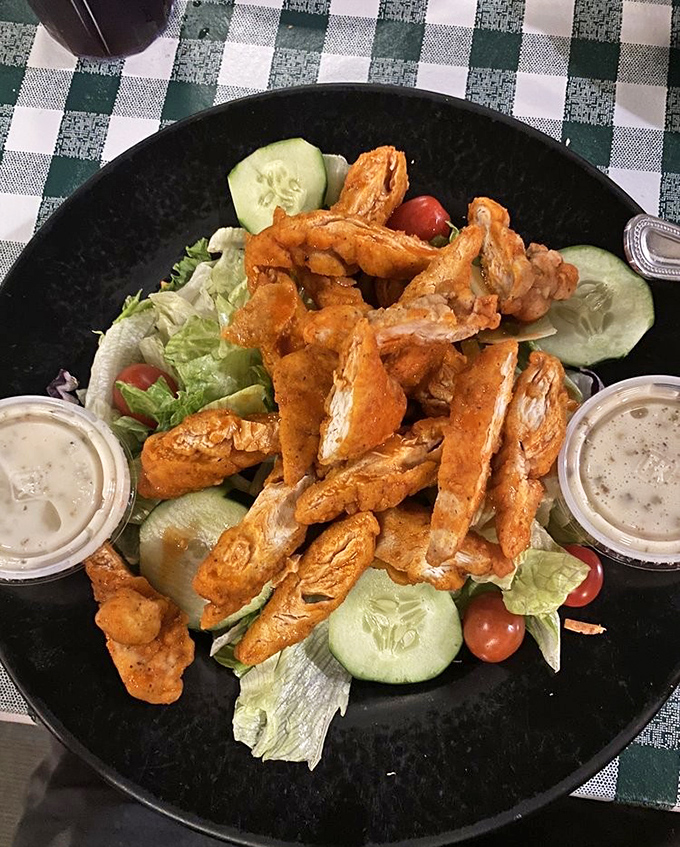 Buffalo chicken salad that answers the eternal question: "Can I have wings and still pretend I'm eating healthy?" with a resounding "Yes!"