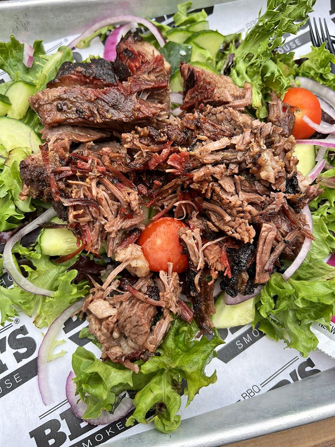 Barbecue atop fresh greens – the culinary equivalent of wearing a tuxedo t-shirt, simultaneously honoring and winking at proper nutrition.