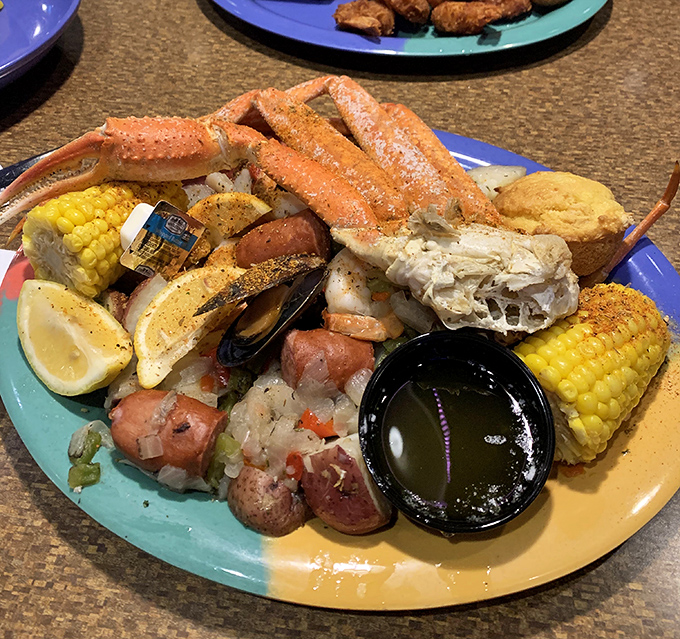 A seafood boil that looks like it was airlifted straight from a Gulf Coast beach &ndash; crab legs, corn, potatoes, and zero restraint.