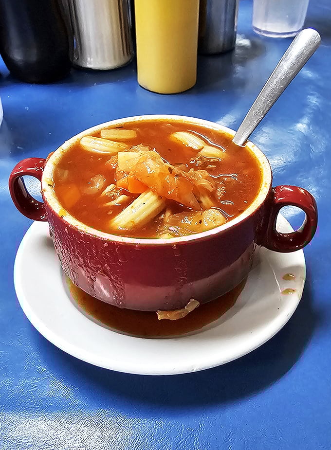 This isn't just soup&mdash;it's a steaming bowl of vegetable diplomacy where carrots and potatoes have achieved perfect harmony in a tomato-based United Nations.