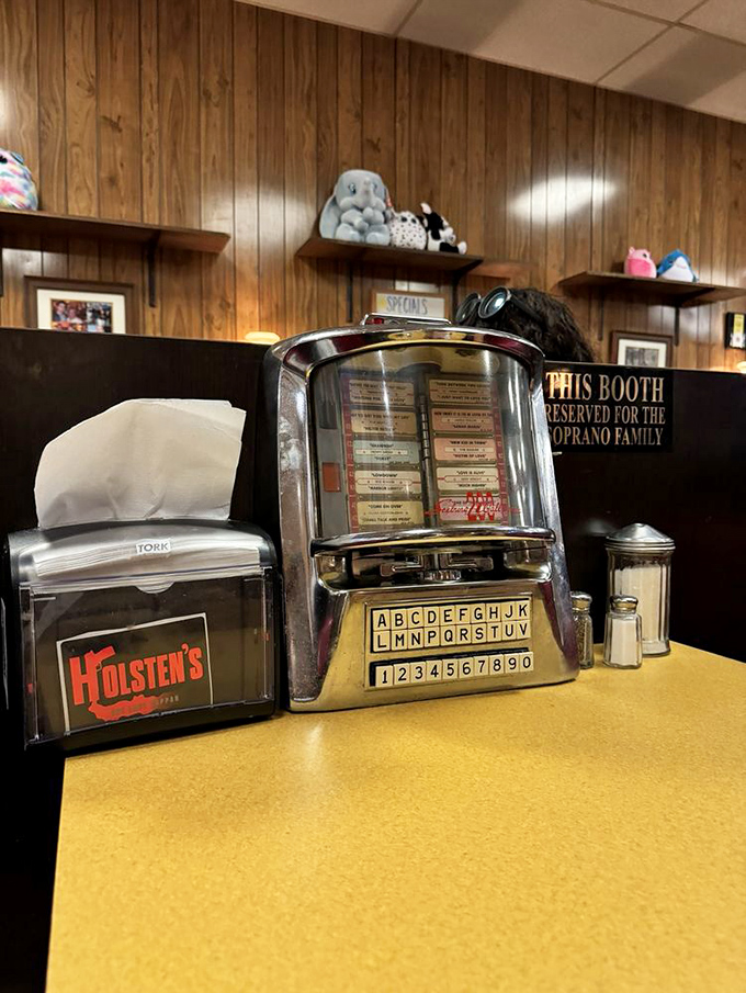 Yes, that's a "Reserved for the Soprano Family" sign. TV history meets ice cream history in one iconic booth.
