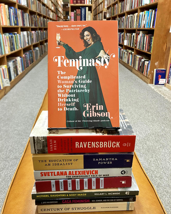A tower of feminist literature that proves the pen is mightier than the patriarchy, stacked with the precision of a literary Jenga master.