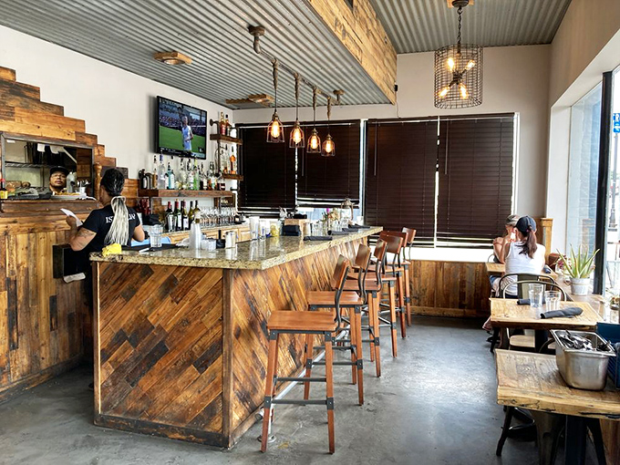A bar crafted with the same attention to detail as the food. Those pendant lights aren't just illuminating the space&mdash;they're setting the stage.